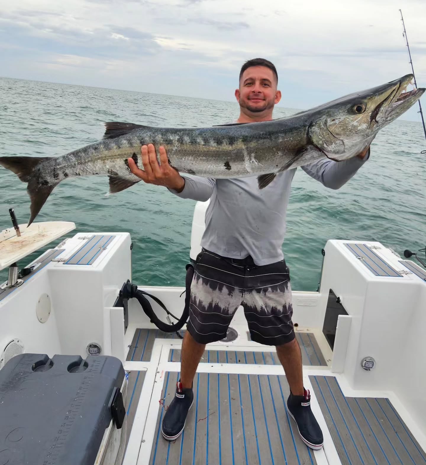 Fishing influencer hugs SHARK before returning it to sea - What's The Jam